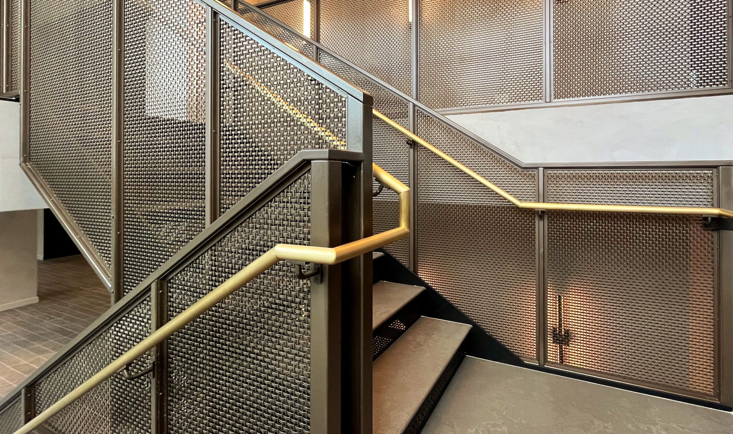 New York Stairwell Design Showcasing Woven Wire Mesh Elegance Banker Wire